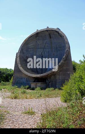 The Denge Sound Mirrors a cluster of concrete structures on the edge of ...