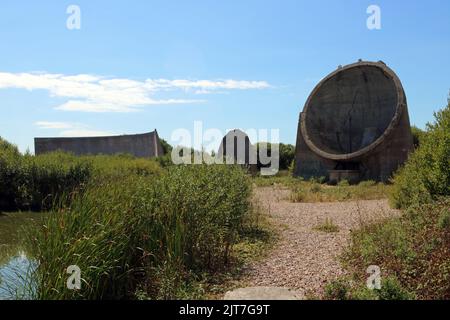 The Denge Sound Mirrors a cluster of concrete structures on the edge of ...