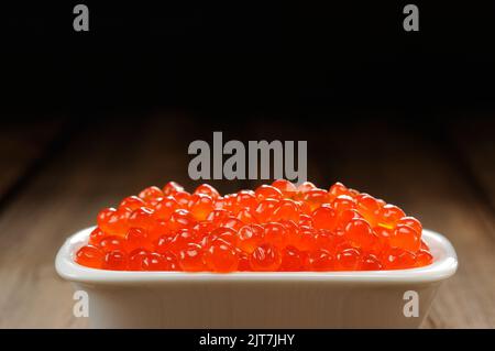 Red caviar in white bowl closep macro Stock Photo - Alamy
