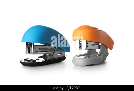 Colorful staplers on white background Stock Photo - Alamy