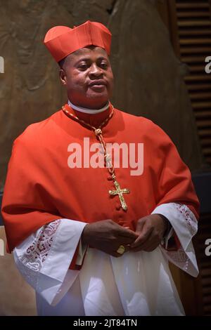 New Cardinal Peter Ebere Okpaleke receives the red three-cornered ...