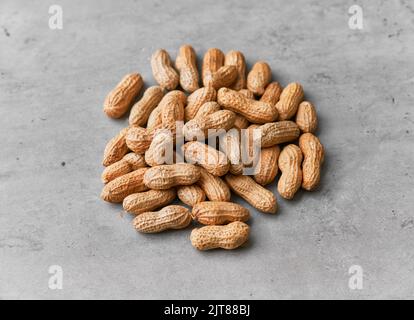 Image of bunch of peanuts on a concrete surface Stock Photo - Alamy