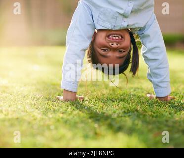 Cute little girl doing handstand indoors. Gymnastics Stock Photo - Alamy