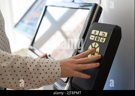 A woman uses a voting device for blind and visually impaired citizens ...