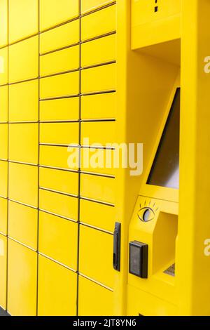Modern yellow shopping locker. Bar code reader for Skans QR Code on ...