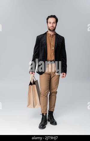 Autumn clothing. Bearded man with shopping basket. Warm clothes ...