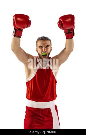 Winner emotions. Male boxer in blue uniform and boxing gloves shouting ...