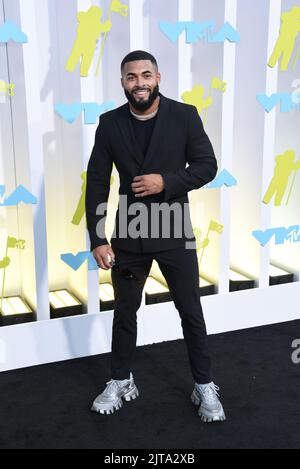 Johnny Middlebrooks walking on the black carpet at the 2022 MTV Video ...