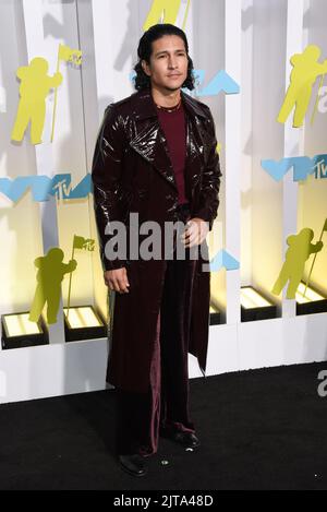 Danny Ramirez walking on the black carpet at the 2022 MTV Video Music ...