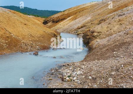 hot hydrogen sulfide stream among the banks of volcanic ash and tephra ...