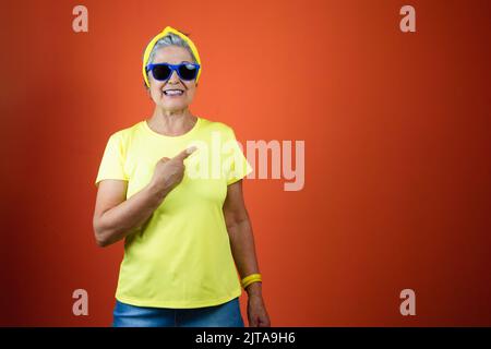 Brazil Independence Day - Mature Woman with Gray Hair, yellow shirt ...