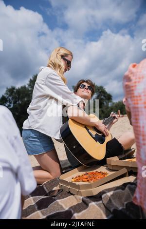 Young woman with tasty pizza playing video game at home Stock Photo - Alamy