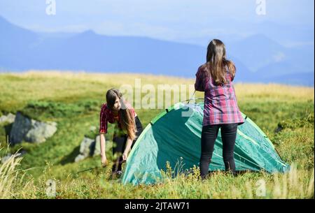 Helpful to have partner for raising tent. Prepare for night. Girl scout ...