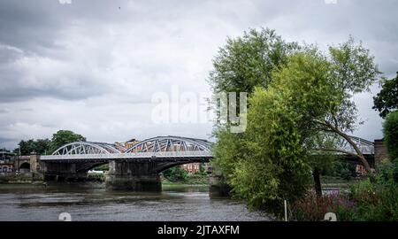 chiswick bridge, crossing the river thames, seen at low tide from ...