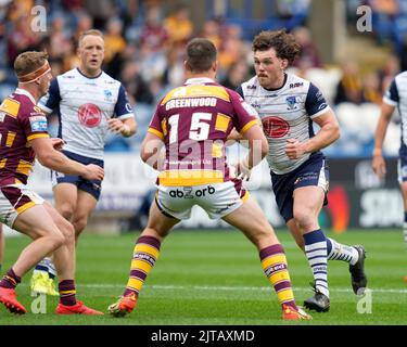Luke Yates of Warrington Wolves runs out before the Betfred Super ...