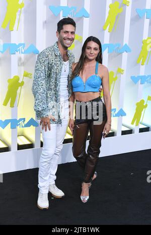Nev Schulman and Laura Perlongo attends the 2022 MTV VMAs at Prudential ...