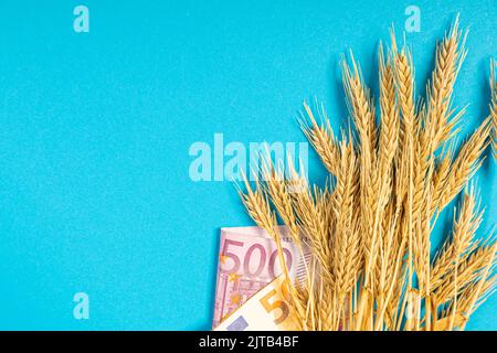 Euro banknotes with flour in paper bag on wicker tray for food prices ...