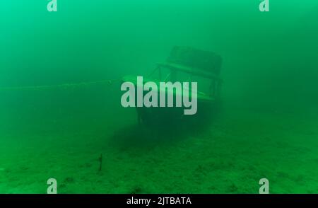 Gloomy underwater wreck of recreational speed boat Stock Photo - Alamy