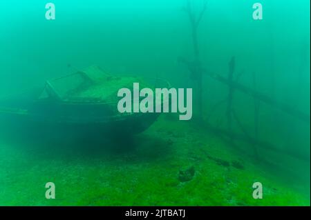 Gloomy underwater wreck of recreational speed boat Stock Photo - Alamy