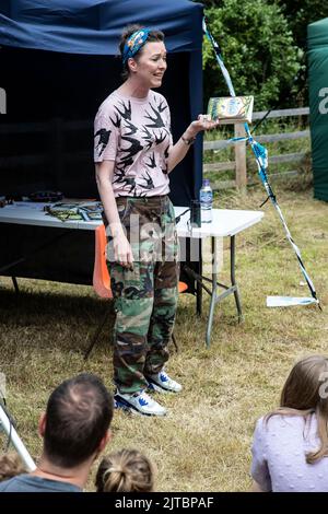 M G Leonard the best selling children's author signs a dedication in ...
