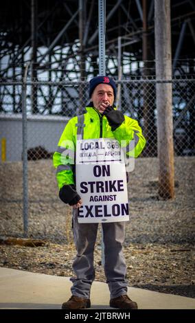 The workers in Boston walk the picket line during a worker's strike ...