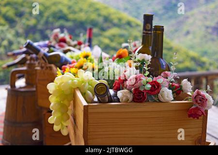 Composition with bottles of wine, rose flower and chocolate candies on ...