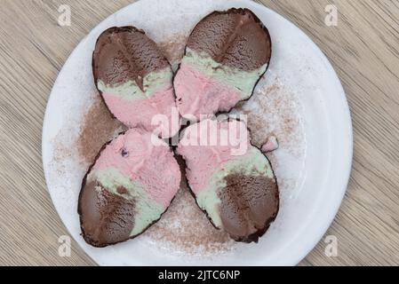 Authentic Italian cuisine dessert of spumoni cut into quarters and ...