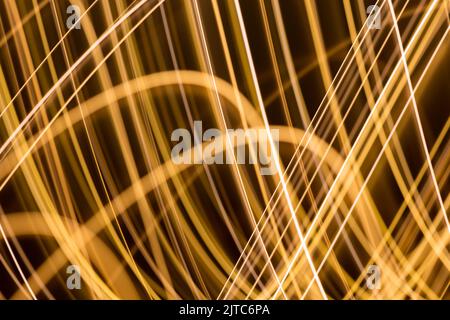 golden electric light effect on dark background Stock Photo - Alamy