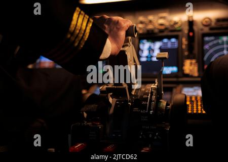 Airplane captain and copilot looking at radar compass on dashboard ...