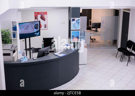 Facility registration counter in waiting area lobby, computer to make ...