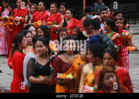 Bhaktapur, Bagmati, Nepal. 30th Aug, 2022. A Hindu woman handles her ...