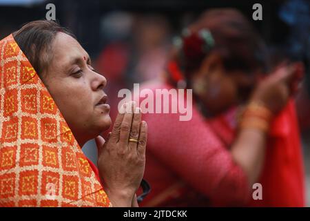 Bhaktapur, Bagmati, Nepal. 30th Aug, 2022. A Hindu woman handles her ...