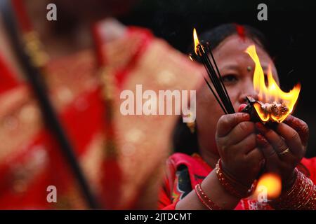 Bhaktapur, Bagmati, Nepal. 30th Aug, 2022. A Hindu woman handles her ...