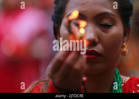 Bhaktapur, Bagmati, Nepal. 30th Aug, 2022. A Hindu woman handles her ...