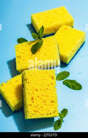 Bright yellow sponges for washing dishes. Organic cleaning concept ...
