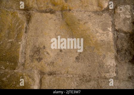 Close up smoothed worn ancient Roman stone floor sidewalk or road ...