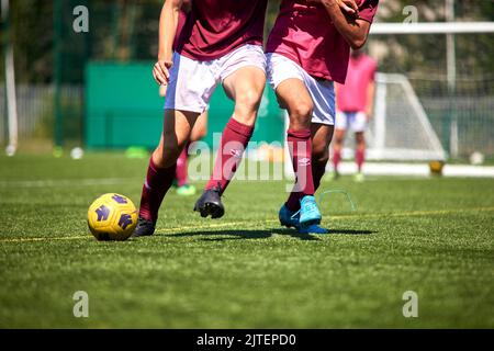 Football skills children playing on astro turf pitches Stock Photo - Alamy