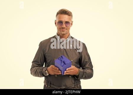 Happy caucasian guy in trenchcoat give present gift box isolated on ...