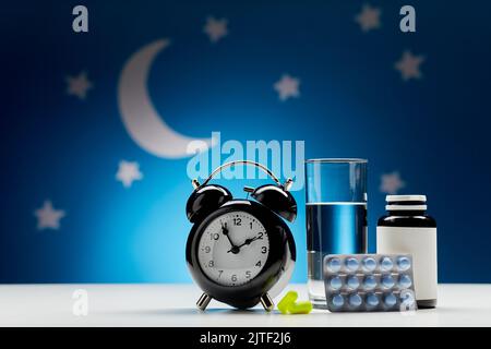 Alarm clock with pill bottle and glass of water on table in kitchen ...