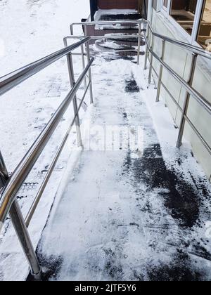 Modern ramp with metal railings for accessible movement of people with ...