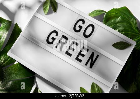 light box with go green words and leaves Stock Photo - Alamy