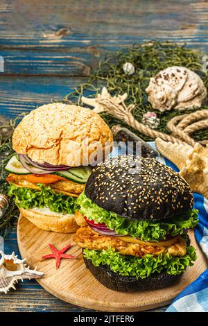 Homemade fish burgers. Fresh ingredients, ripe vegetables, fast food ...