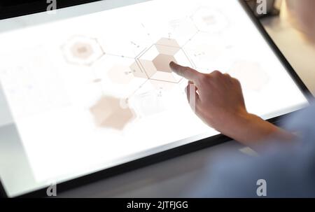 hands on led light tablet at office Stock Photo - Alamy