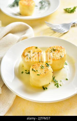 Cooked fondant potatoes over light background. Top view, flat lay Stock ...