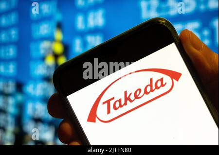 In this photo illustration, the logo of Takeda Pharmaceutical is seen ...