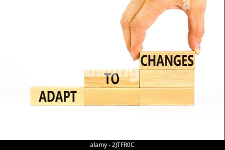 Adapt to changes symbol. Concept words Adapt to changes on wooden ...
