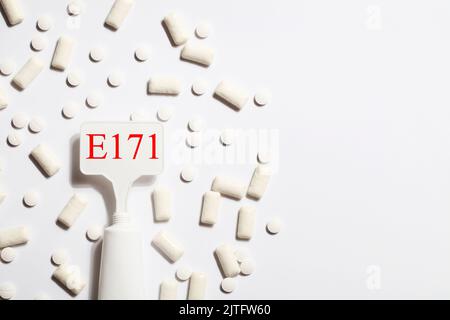 Titanium dioxide, E171, dangerous additive concept. gum, pills ...