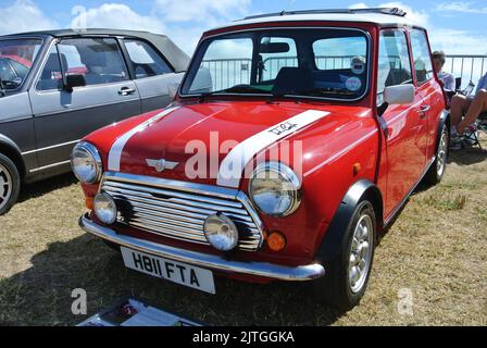 A 1990 Rover Mini Cooper parked on display at the English Riviera ...