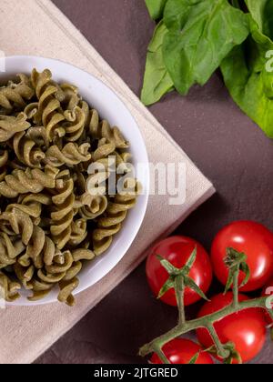 Raw spinach screw noodles, vegetarian, vegan . Healthy food Stock Photo ...