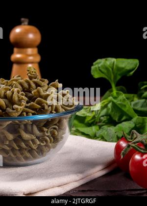 Raw spinach screw noodles, vegetarian, vegan . Healthy food Stock Photo ...
